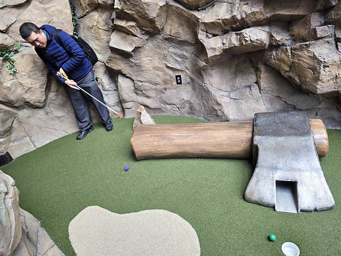 This oversized axe hole challenges players to thread their putt through the handle &ndash; Paul Bunyan would be impressed by your precision.