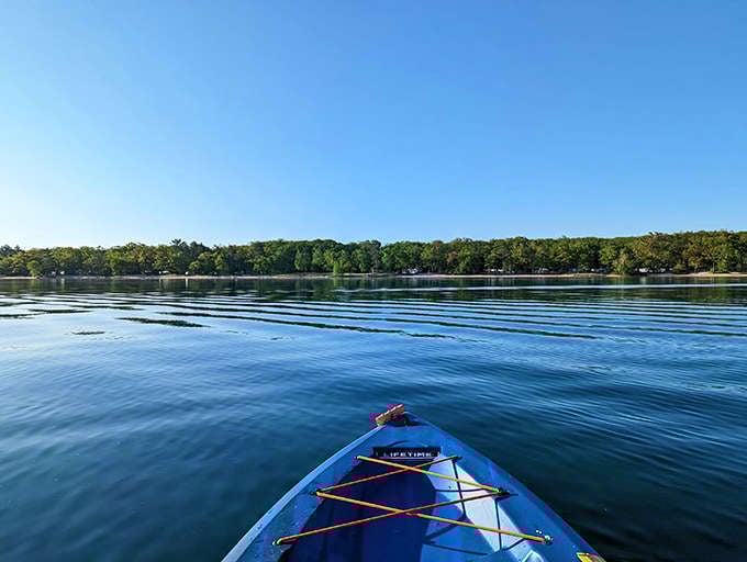 Kayaking Higgins Lake offers front-row seats to Michigan's natural splendor, with water so clear it's like floating on air.
