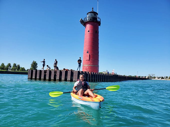 Kayaking fun on the clear blue waters of Lake Michigan! The iconic Kenosha lighthouse makes for a perfect summer backdrop.