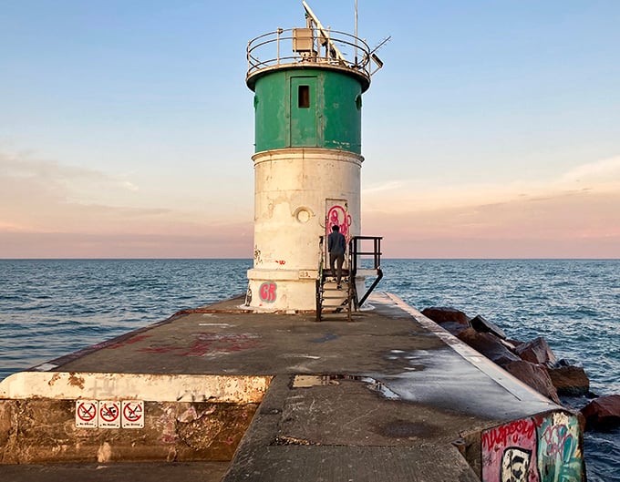 The weathered lighthouse stands like an old sea captain, telling silent stories of storms weathered and ships guided safely home.