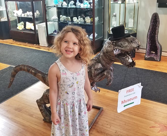 Young explorers find their dinosaur dreams coming true &ndash; complete with a dapper prehistoric greeter sporting formal headwear!
