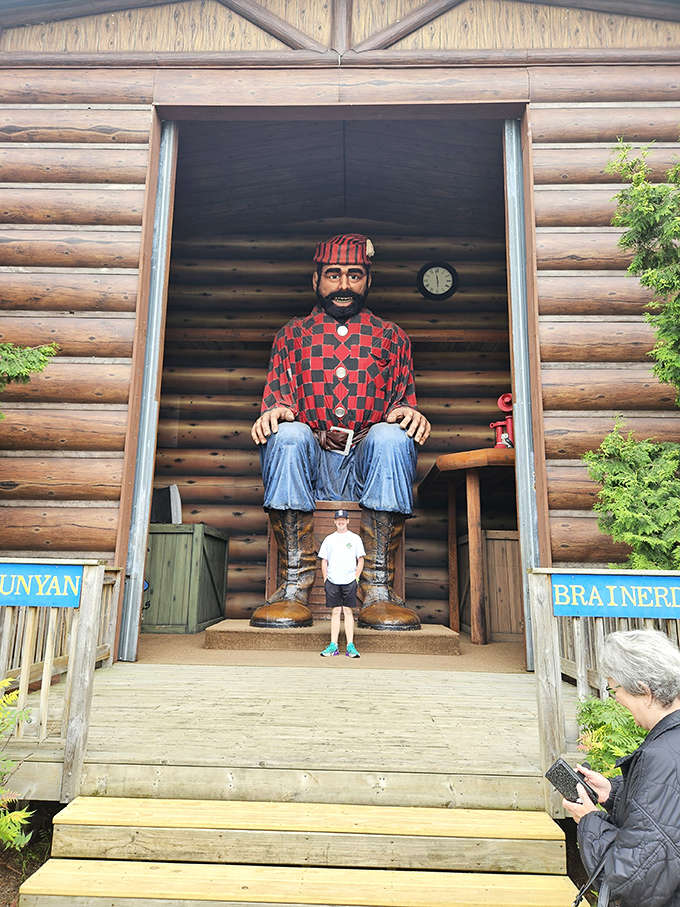 The doorway perspective perfectly captures the jaw-dropping scale of Paul Bunyan &ndash; making even adults feel child-sized in comparison.