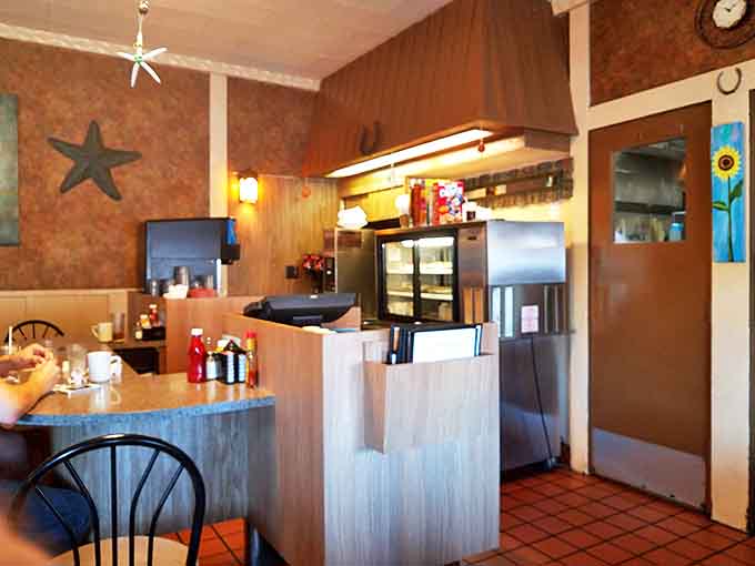 The well-worn wooden bar invites patrons to pull up a stool, order a drink, and become part of this unique establishment's ongoing story.