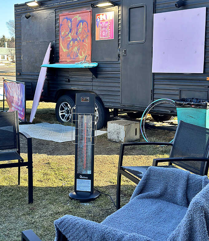 Shook's outdoor setup transforms any parking spot into a tropical oasis, complete with surfboards and colorful accents.