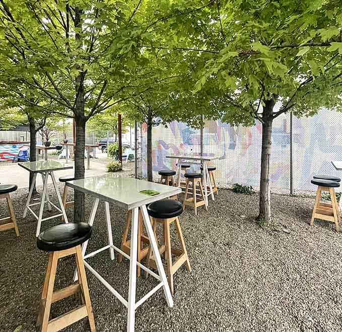Takoi's outdoor dining area feels like a secret garden &ndash; trees provide shade while you savor spicy delights in urban tranquility.
