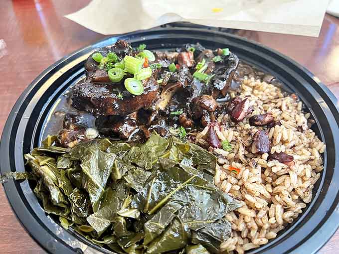Oxtail stew with greens and rice &ndash; a dish so comforting it feels like a warm hug from a Jamaican grandmother you never knew you had.