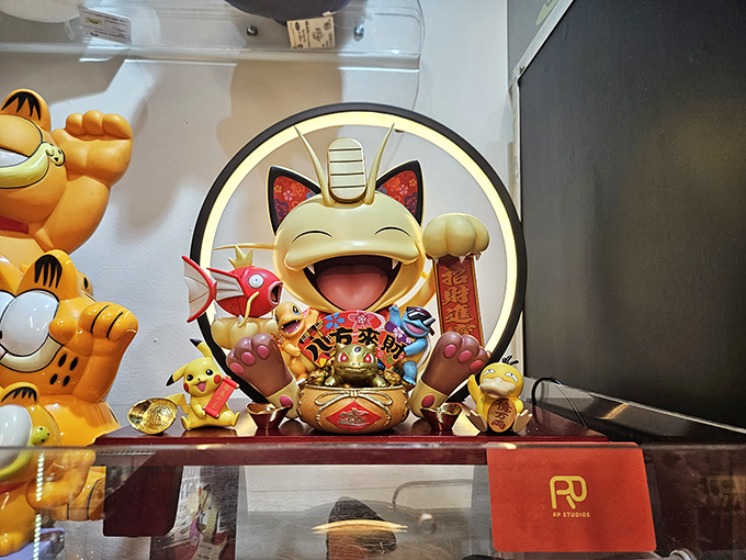 This vibrant Pokemon-inspired lucky cat figurine demonstrates how traditional Japanese symbols blend seamlessly with modern animation characters.