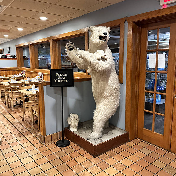 The restaurant's famous polar bear greeter stands eternally vigilant, silently judging those who don't clean their breakfast plates.