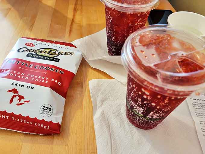 Local Michigan Cherry BBQ chips paired with housemade hibiscus tea &ndash; proof that even the sides and beverages get the star treatment here.