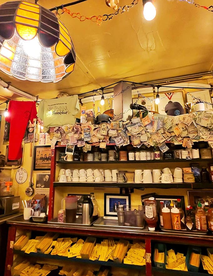 The preparation area doubles as performance space, where cooks execute a carefully choreographed breakfast ballet in quarters tighter than a submarine.