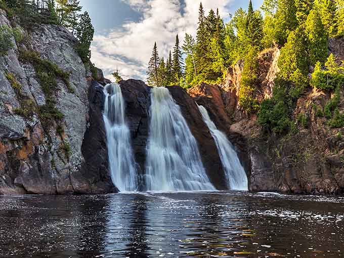 The waterfall performs its timeless dance between rugged cliffs, a natural spectacle that's been running continuously since before tickets existed.