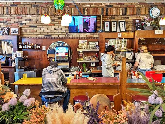 Morning light streams through the windows, illuminating the classic diner counter where countless cups of coffee have fueled Minnesota conversations.