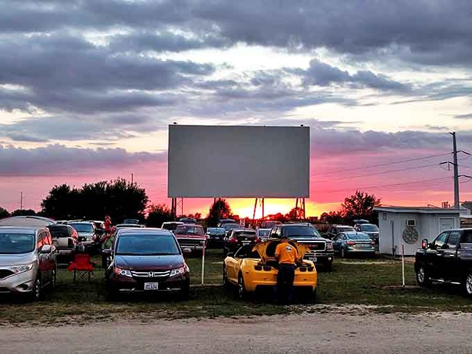 Nature's grand finale &ndash; sunset transforms the rocky outcrop into a silhouette against a canvas of orange and gold.