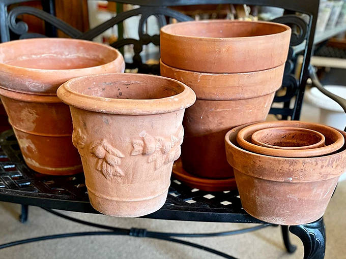 Weathered terracotta pots bear the beautiful patina that only comes from years nurturing plant life &ndash; gardeners will understand their silent stories.