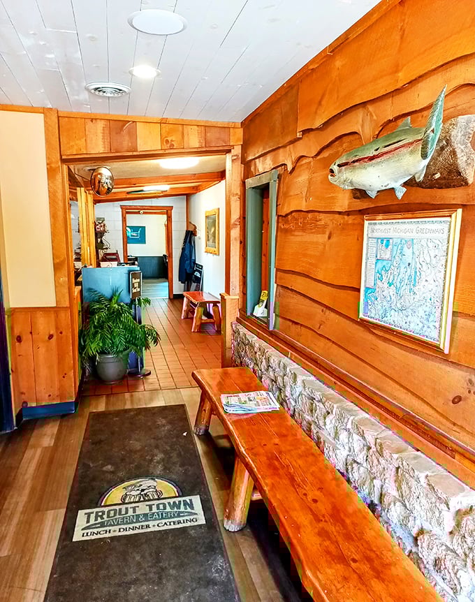 The welcoming entrance hallway sets the tone immediately &ndash; warm wood paneling, fishing memorabilia, and that "come on in" feeling.
