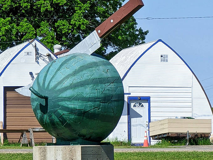 Fresh slice of artistic genius! This watermelon sculpture with its perfectly placed knife makes for the ultimate roadside photo opportunity.