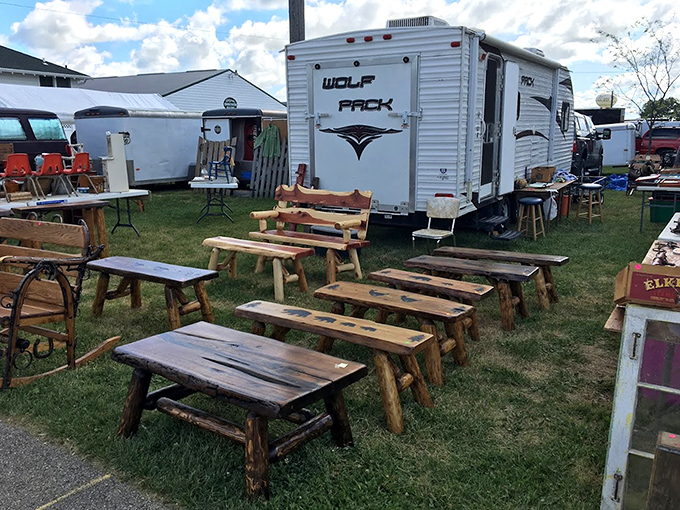 Rustic handcrafted benches display the beauty of reclaimed wood, each with unique character and patina.