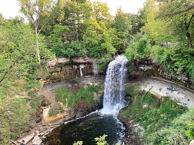 Take in the breathtaking overhead view of the falls as they plunge into the rocky basin surrounded by lush summer.