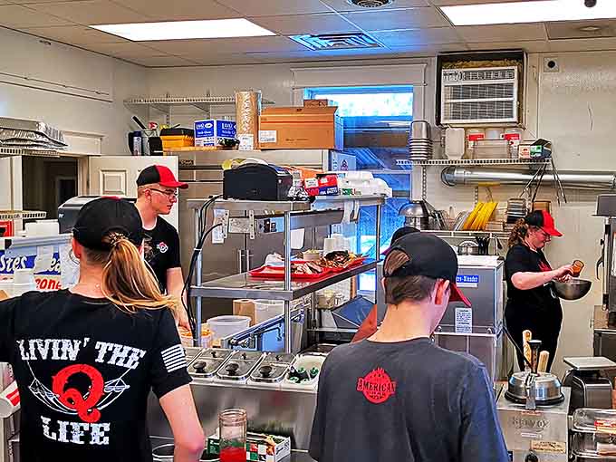 Behind the scenes, dedicated staff members work their magic, transforming raw ingredients into barbecue masterpieces with practiced precision.