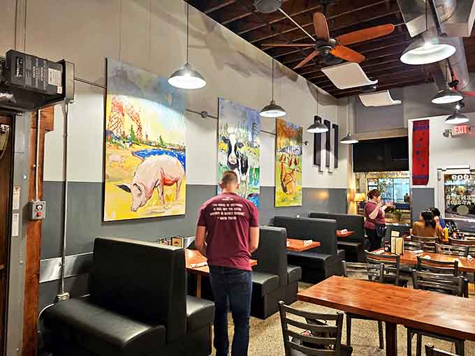 Colorful pig artwork watches over diners &ndash; a playful reminder of the delicious sacrifices made for your dining pleasure.