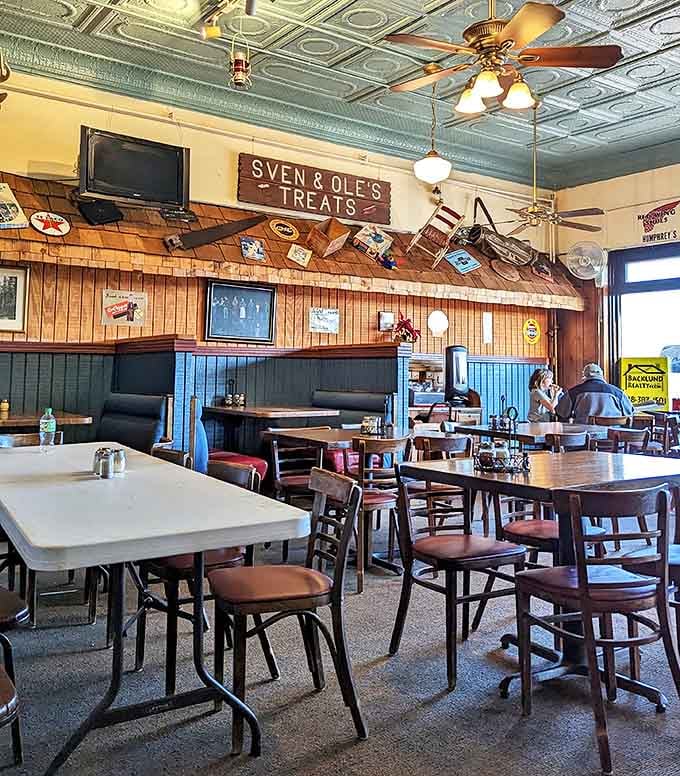 Every inch of wall space tells a story, while the blue booths have absorbed decades of North Shore tales and pizza-fueled conversations.