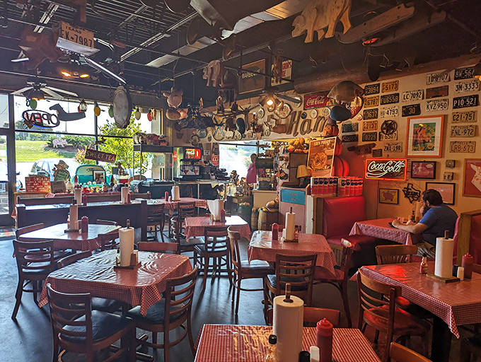 Warm wood paneling and string lights create intimate corners where conversations can flourish away from the main bar's bustle.