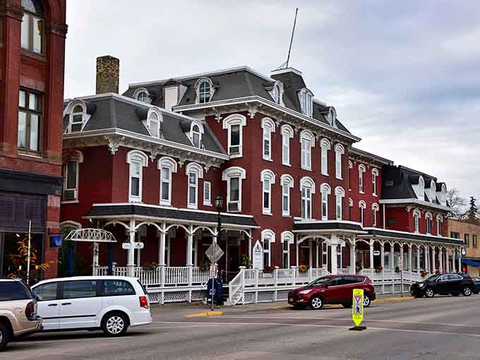The magnificent Archer House River Inn has welcomed travelers since 1877, its distinctive red brick Victorian architecture defining Northfield's skyline.