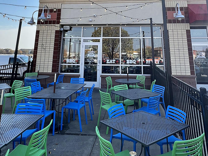 Colorful outdoor seating invites lingering conversations and the making of new friends bonded by the universal language of great barbecue.