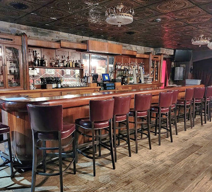 The bar beckons with warm wood tones and comfortable seating &ndash; where mixologists craft liquid history one cocktail at a time.