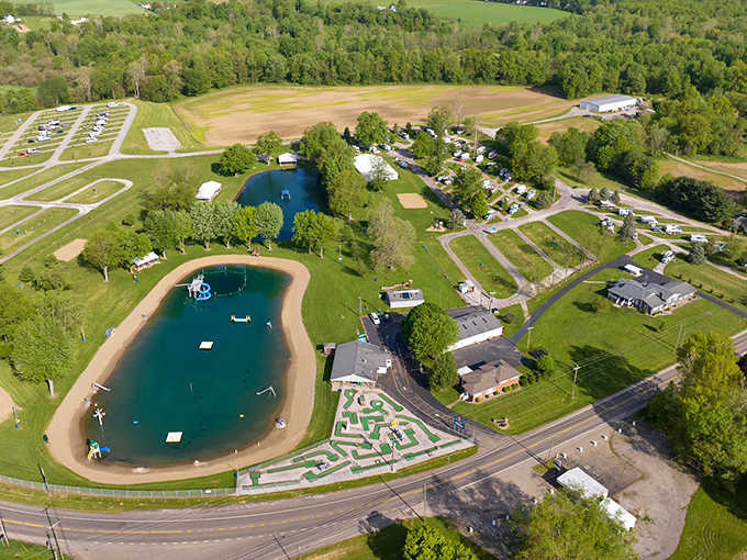 An aerial view reveals the perfect layout – swimming areas, camping spaces, and recreation facilities nestled in Ohio's rolling countryside.