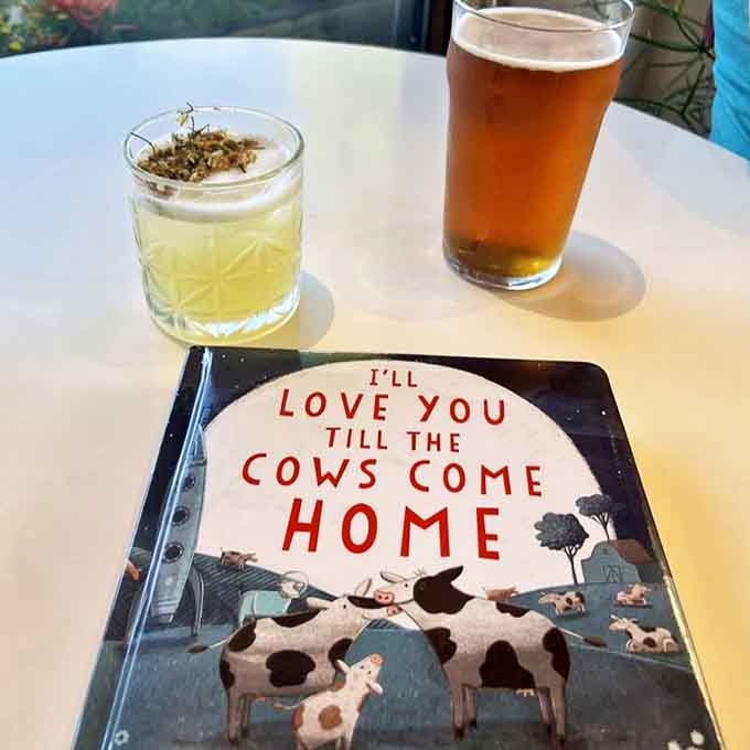 The Beekeeper cocktail arrives alongside "I'll Love You Till the Cows Come Home" – proof that The Literary pairs drinks with experiences.