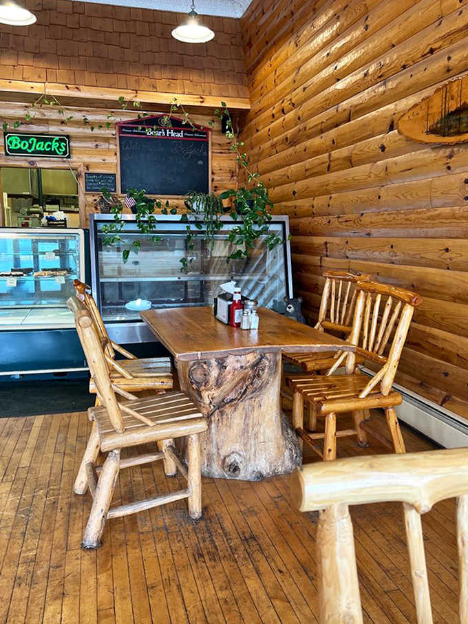 Rustic log walls and handcrafted furniture create an atmosphere where time slows down and conversations flow as freely as the coffee.