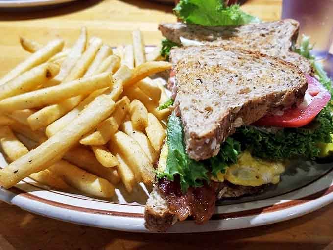 The Boss Lady BLT with an egg proves that sometimes the best flights are the ones that combine classic routes with unexpected detours.