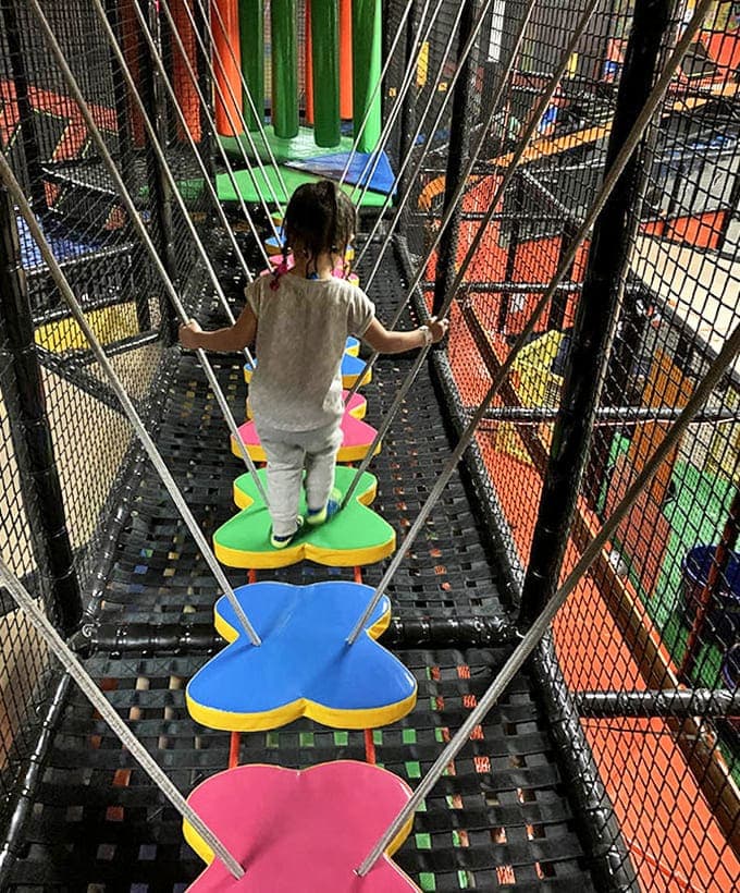 Cross this butterfly-shaped bridge obstacle with the confidence of a tightrope walker or the caution of someone who remembers their insurance deductible.