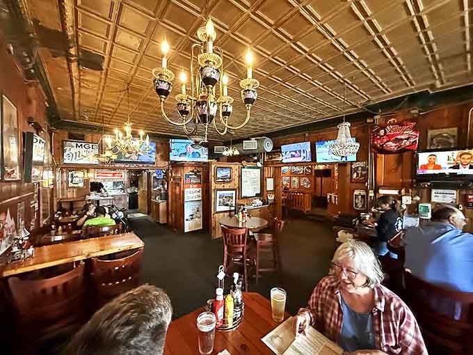 Wood-paneled walls and vintage fixtures create an atmosphere that feels both timeless and welcoming, where every seat tells a different story.