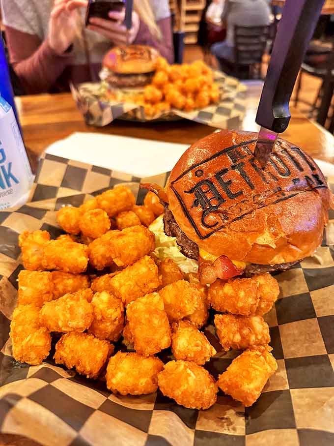 A perfect burger and golden tater tots &ndash; this classic combination proves that sometimes the simplest pleasures are the most satisfying.