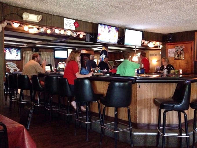 The bustling bar scene where locals and visitors alike gather before dinner, participating in the time-honored supper club ritual.