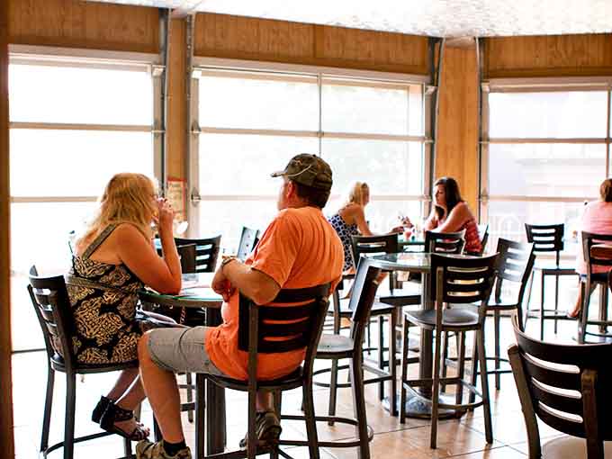 Conversations flow as freely as the wine in this sun-drenched caf&eacute; space where strangers often become friends over shared bottles.