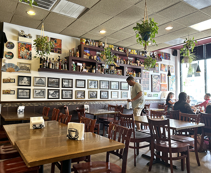 Photos of Cuba line the walls, creating a museum-like tribute to the island while diners create new memories below.