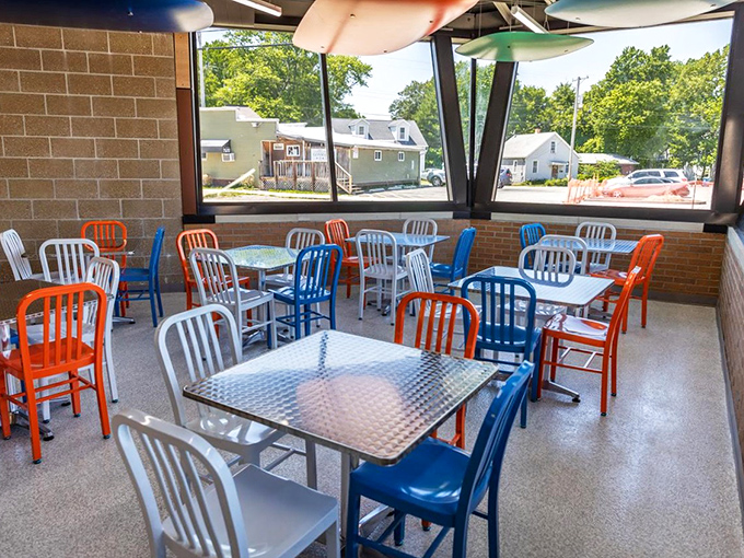 The dining area's colorful chairs and metal tables create a cheerful spot to contemplate life's big questions, like "Should I have ordered two donuts instead of one?"