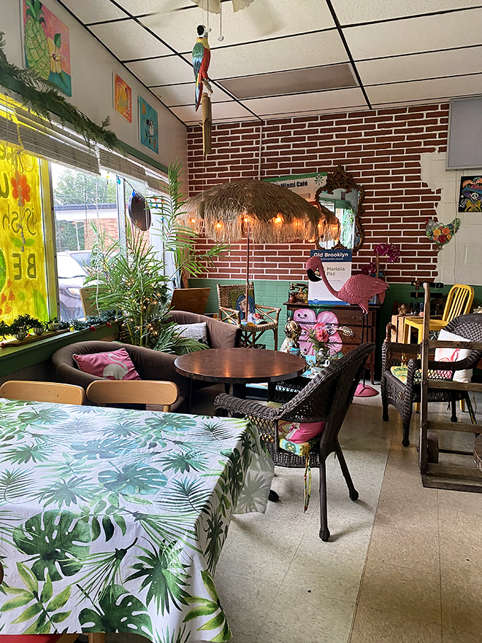 Thatched palapa lighting casts a warm glow over mismatched furniture, creating the perfect backdrop for lingering conversations and second cups of coffee.