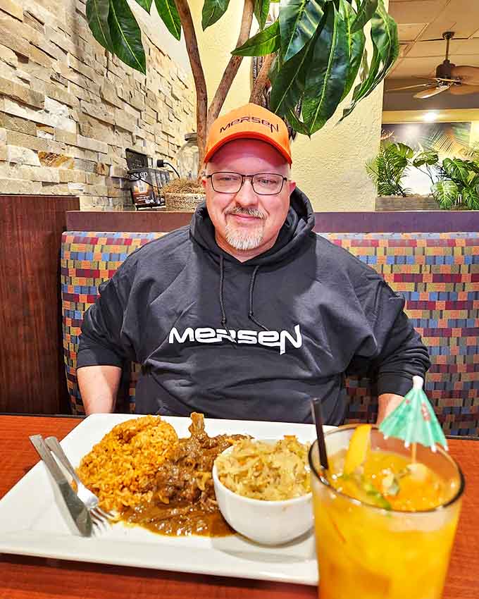 A satisfied customer enjoying the fruits of Jamaica's culinary traditions in the most unlikely of places &ndash; a Michigan strip mall.