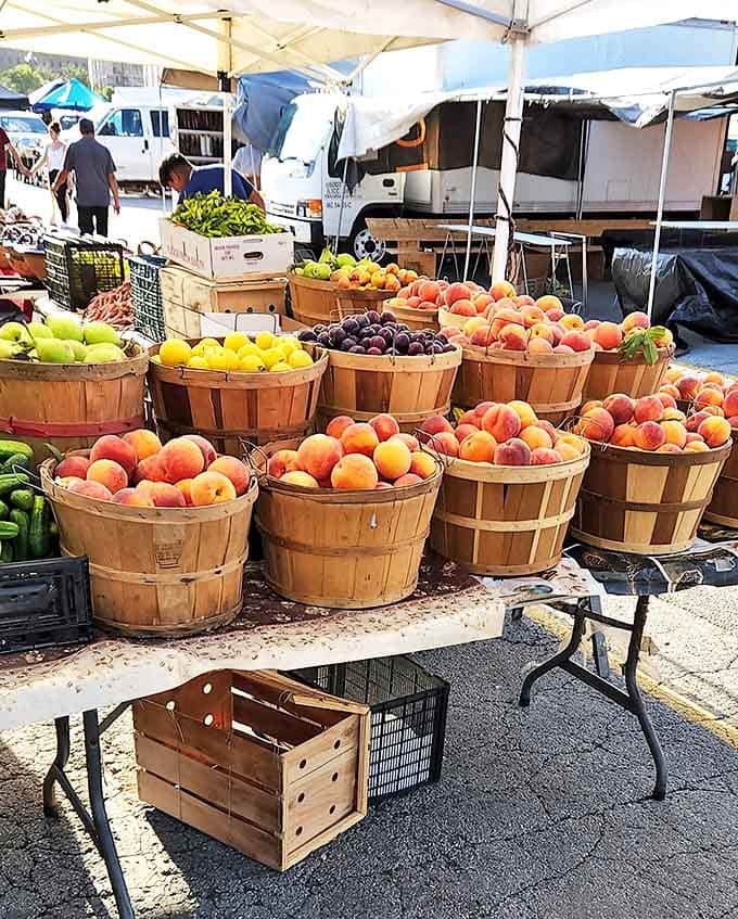 Fresh produce displayed in rustic baskets brings farmers market charm to the flea market experience – nature's candy at its finest.