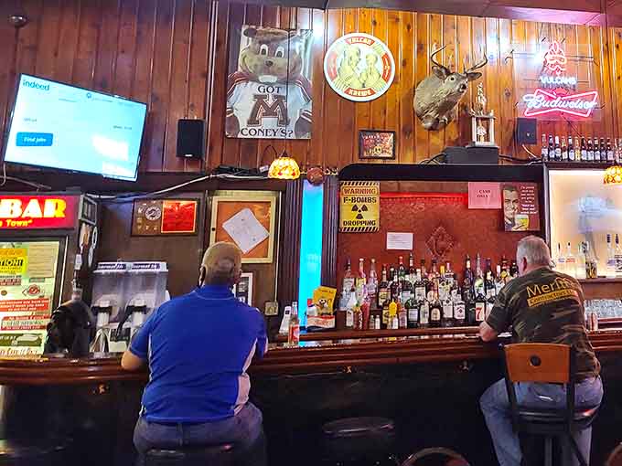 The heart of the operation &ndash; a well-worn wooden bar where cold beers are poured and stories are shared beneath the watchful gaze of taxidermy.