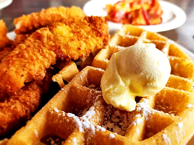 Fried chicken meets waffle in a combination that sounds wrong until you taste it, then suddenly makes perfect sense.