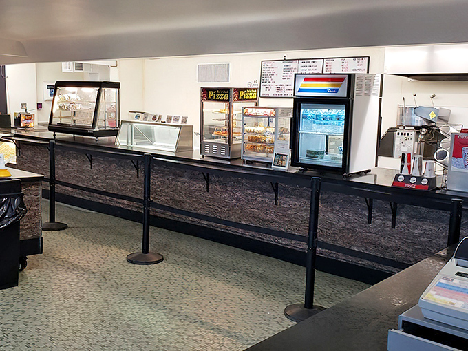 The concession stand's interior maintains that perfect balance of nostalgic charm and practical functionality for serving hungry moviegoers.
