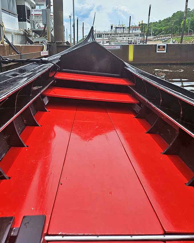 Rich red flooring contrasts with sleek black exteriors, showcasing the authentic craftsmanship of these floating works of art.