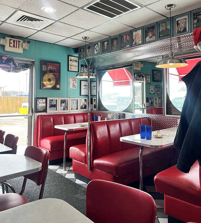 Red vinyl booths cradle diners like old friends, while vintage photos watch over meals shared and memories made.