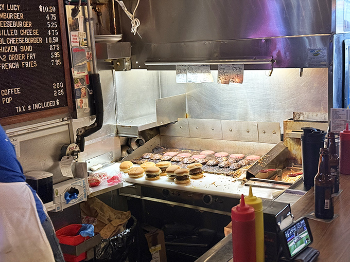 The open kitchen layout lets you watch the magic happen as patties sizzle on the well-seasoned grill.