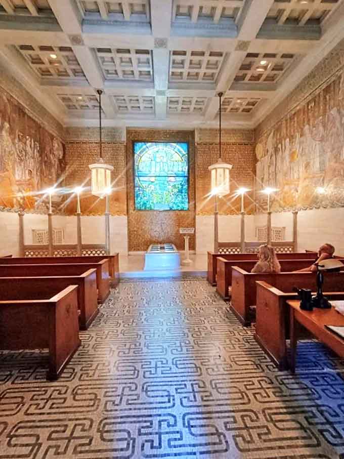 Wade Memorial Chapel's interior showcases Louis Comfort Tiffany's genius through dazzling mosaics and intricate stained glass.